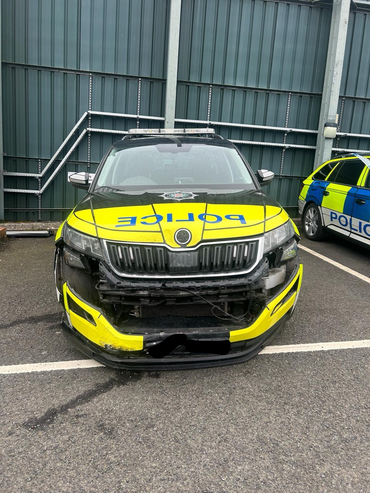 Two police officers require hospital treatment after patrol vehicle ...